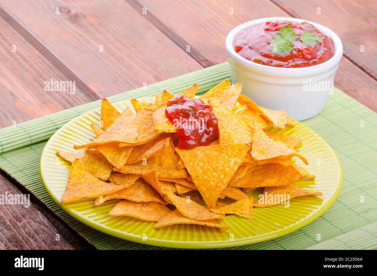 Tortilla chips with spicy tomato salsa with jalapeno Stock Photo - Alamy