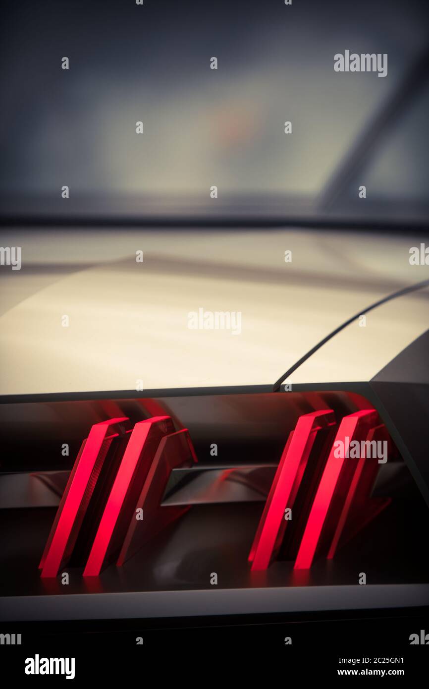 Close up vertical image of the LED tail lights of a new sport super car ...