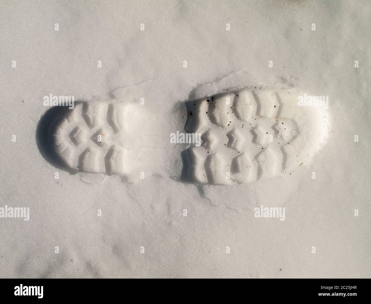 Boot footstep on snow Stock Photo - Alamy