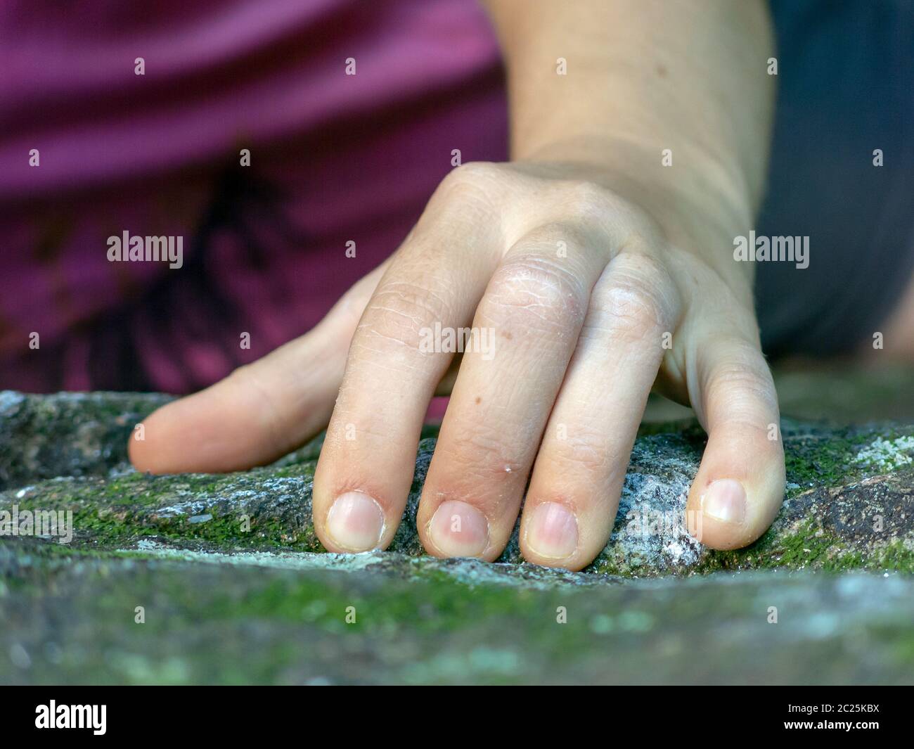 Rock climber hand closeup detail holding climbing Stock Photo - Alamy