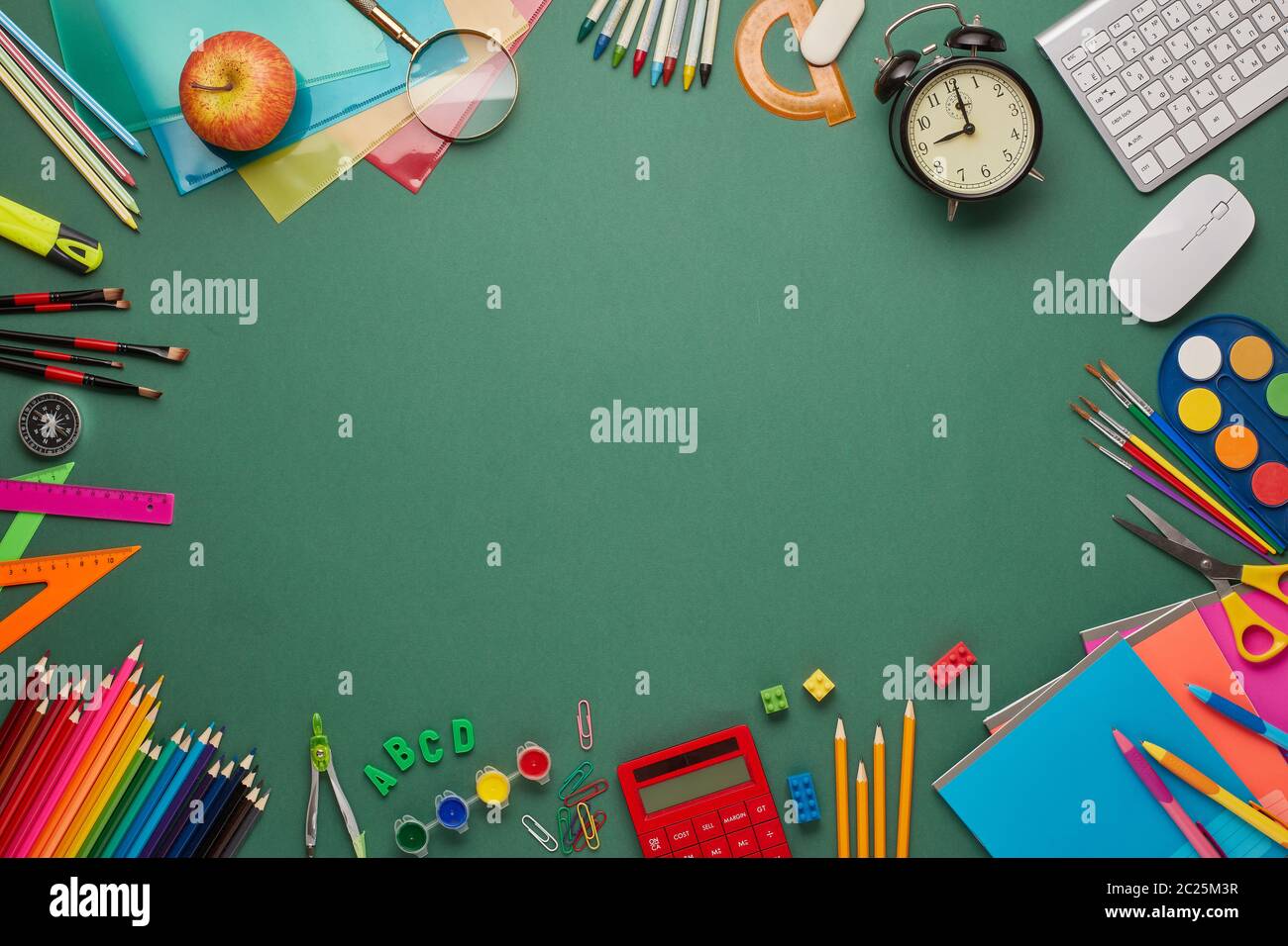 Computer keyboard, alarm clock, calculator, stationery accessories on ...