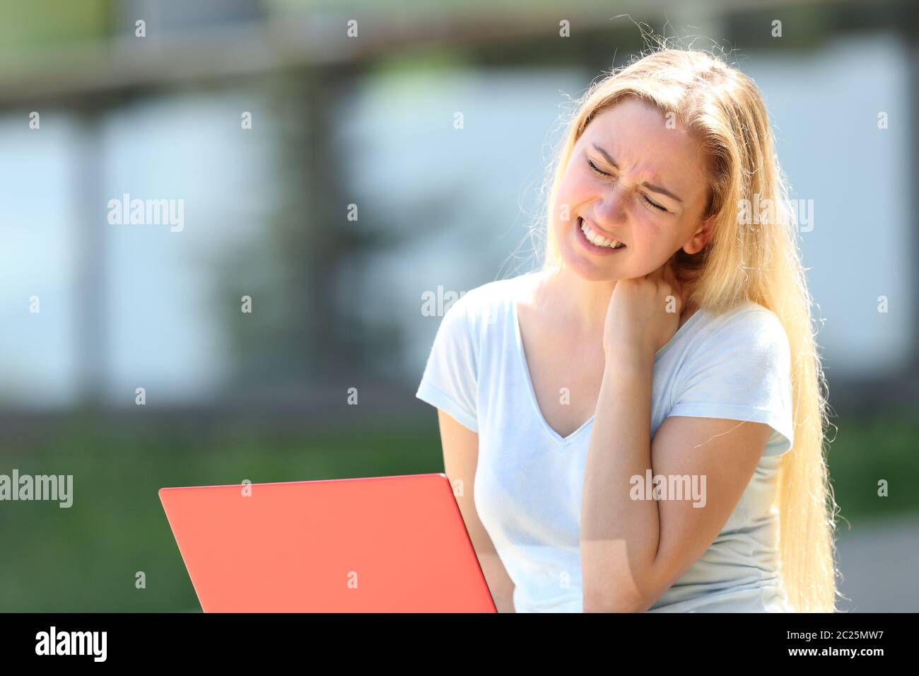 Student complaining suffering neck ache outdoors outdoors in an ...