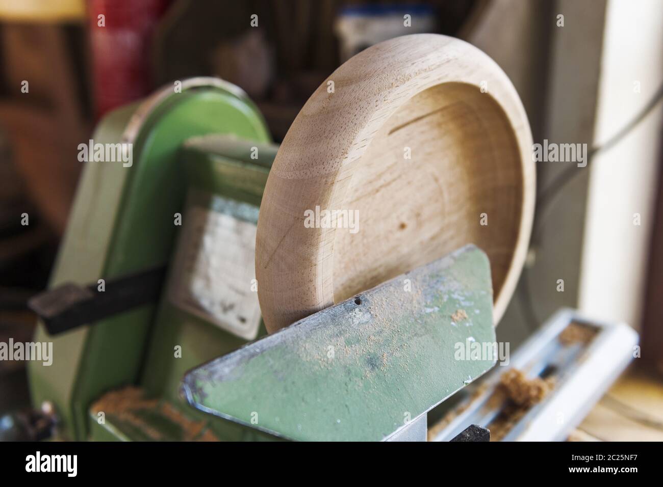 Wooden plate on a lathe Stock Photo - Alamy