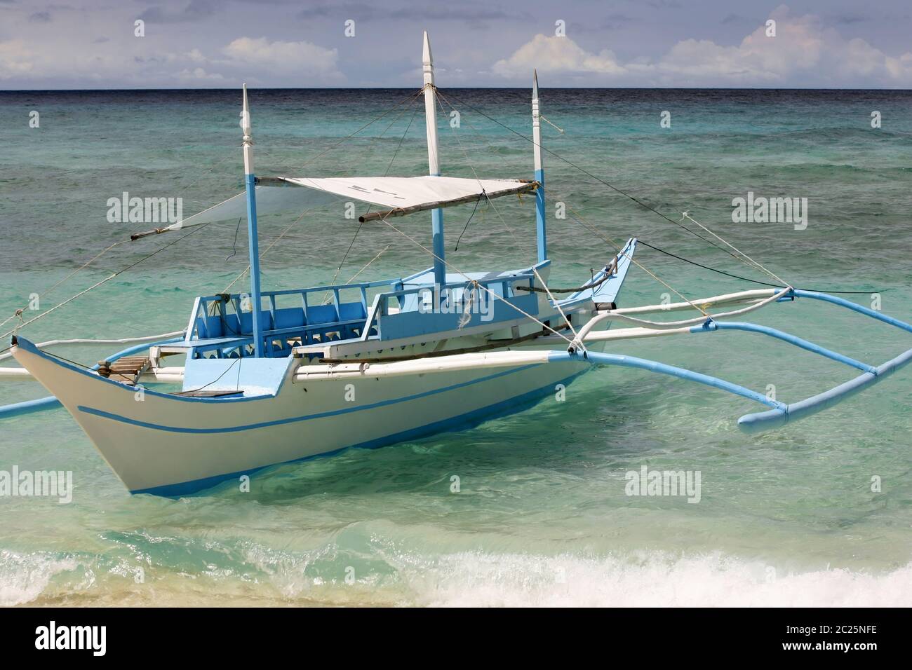 Small boat moored at seaside. Boracay. Philippines Stock Photo - Alamy