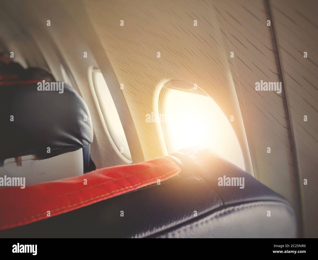 Windows in an airplane cabin with sunlight Stock Photo - Alamy