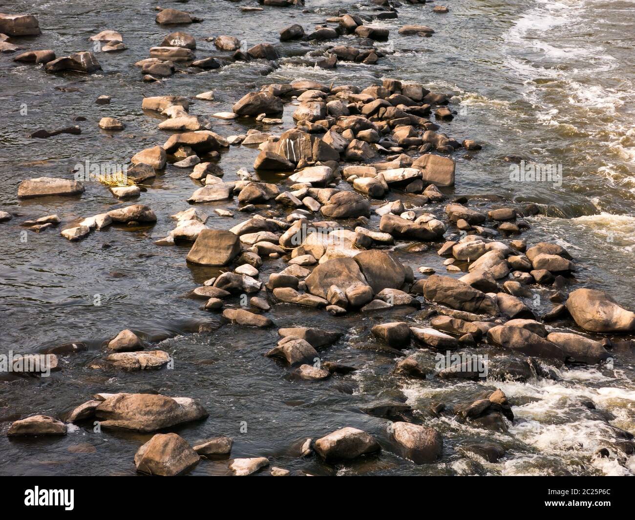 Rocks on water Stock Photo - Alamy