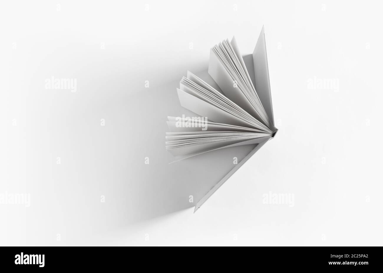 Book with shadow Stock Photo - Alamy