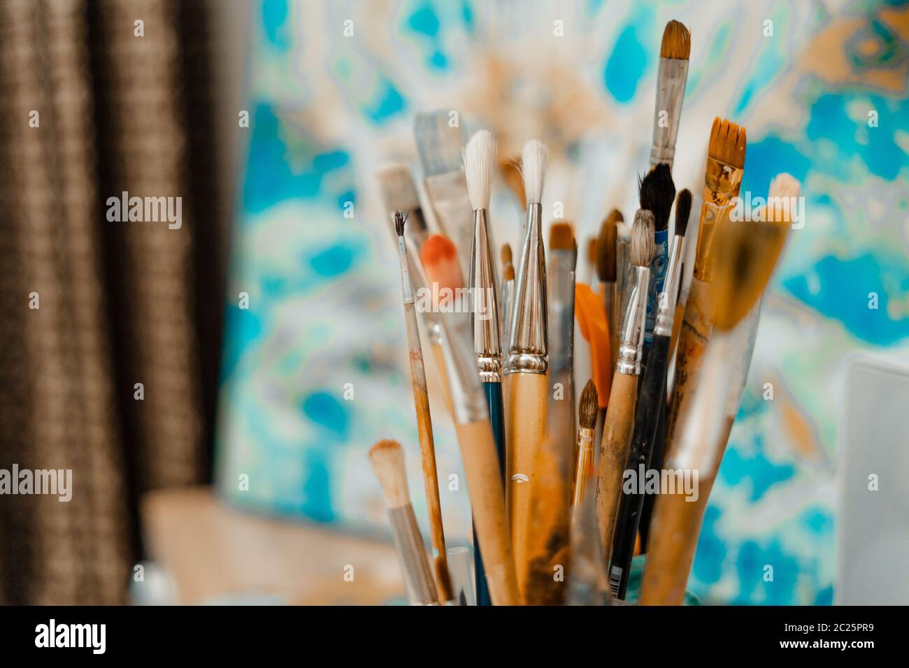 Tools and equipment for the artist. Palette and brushes close-up. The ...