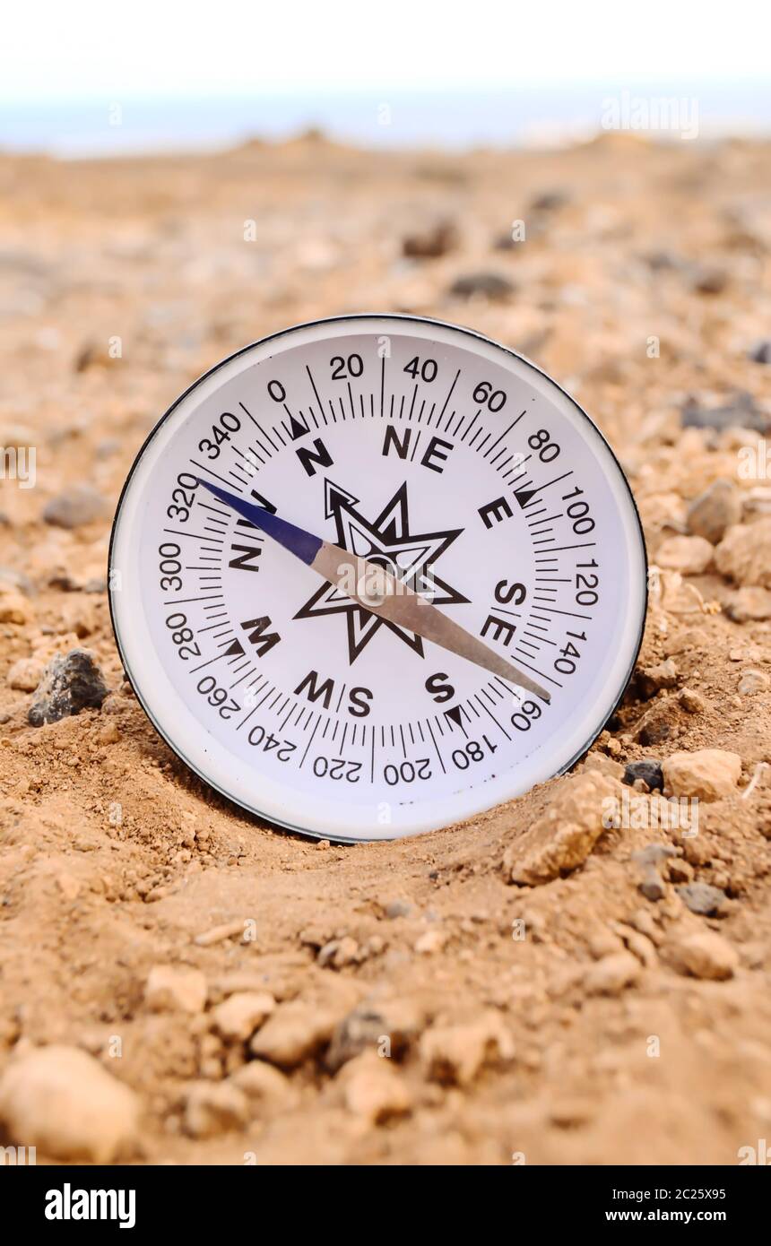 Orientation Concept Metal Compass on a Rock in the Desert Stock Photo ...