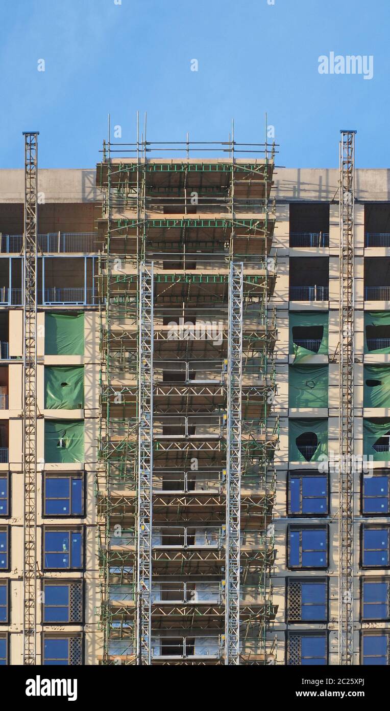 modern multistory apartment building under construction with ...