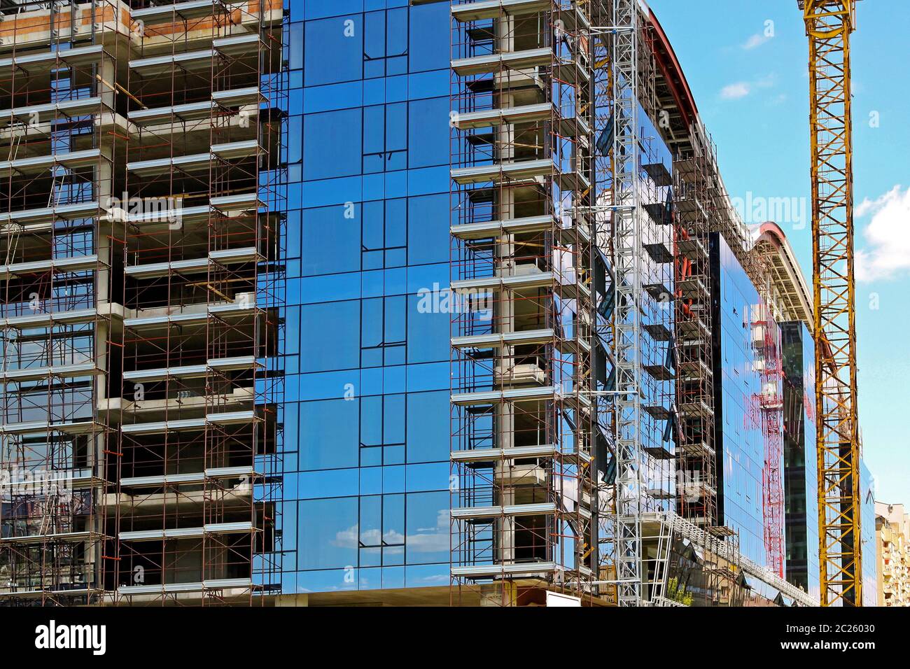 Scaffoldings at blue commercial building during construction Stock ...
