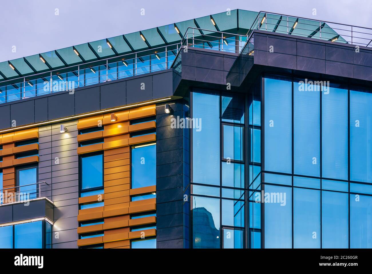 Modern high-rise office building with a glass facade at overcast ...