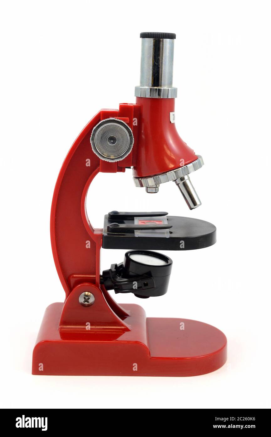 An isolated red microscope for the scientific research and study of the ...