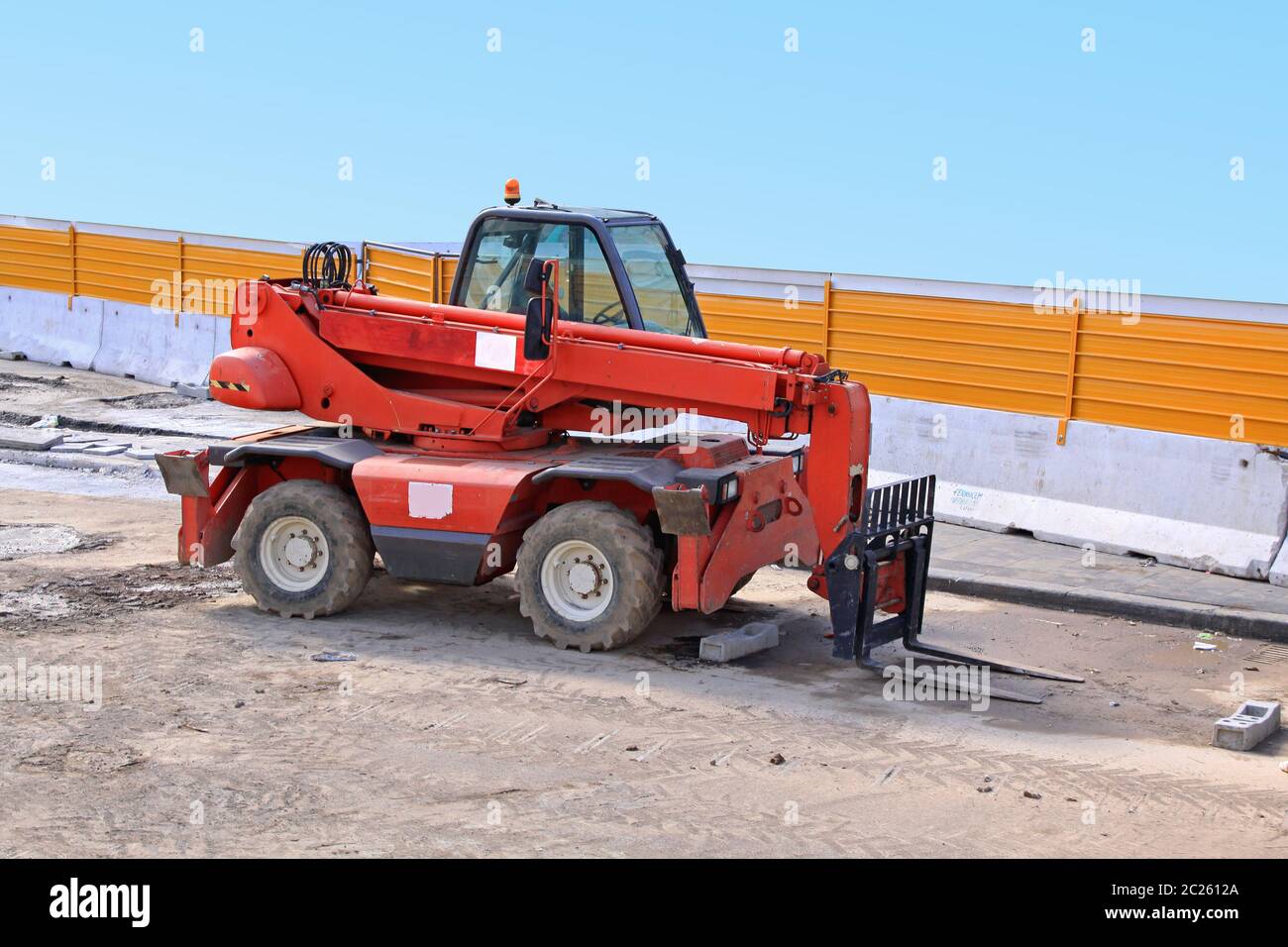 Big Forklift Truck With Long Boom at Construction Site Stock Photo - Alamy