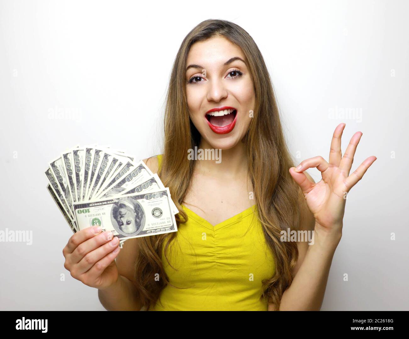 Successful american woman holding fan of money dollar bills and showing ...