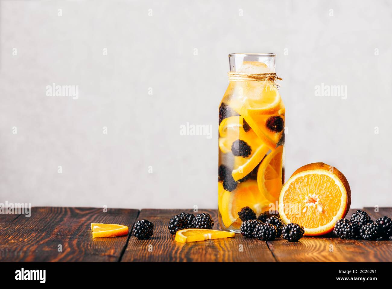 Bottle of Water Infused with Sliced Raw Orange and Fresh Blackberry ...