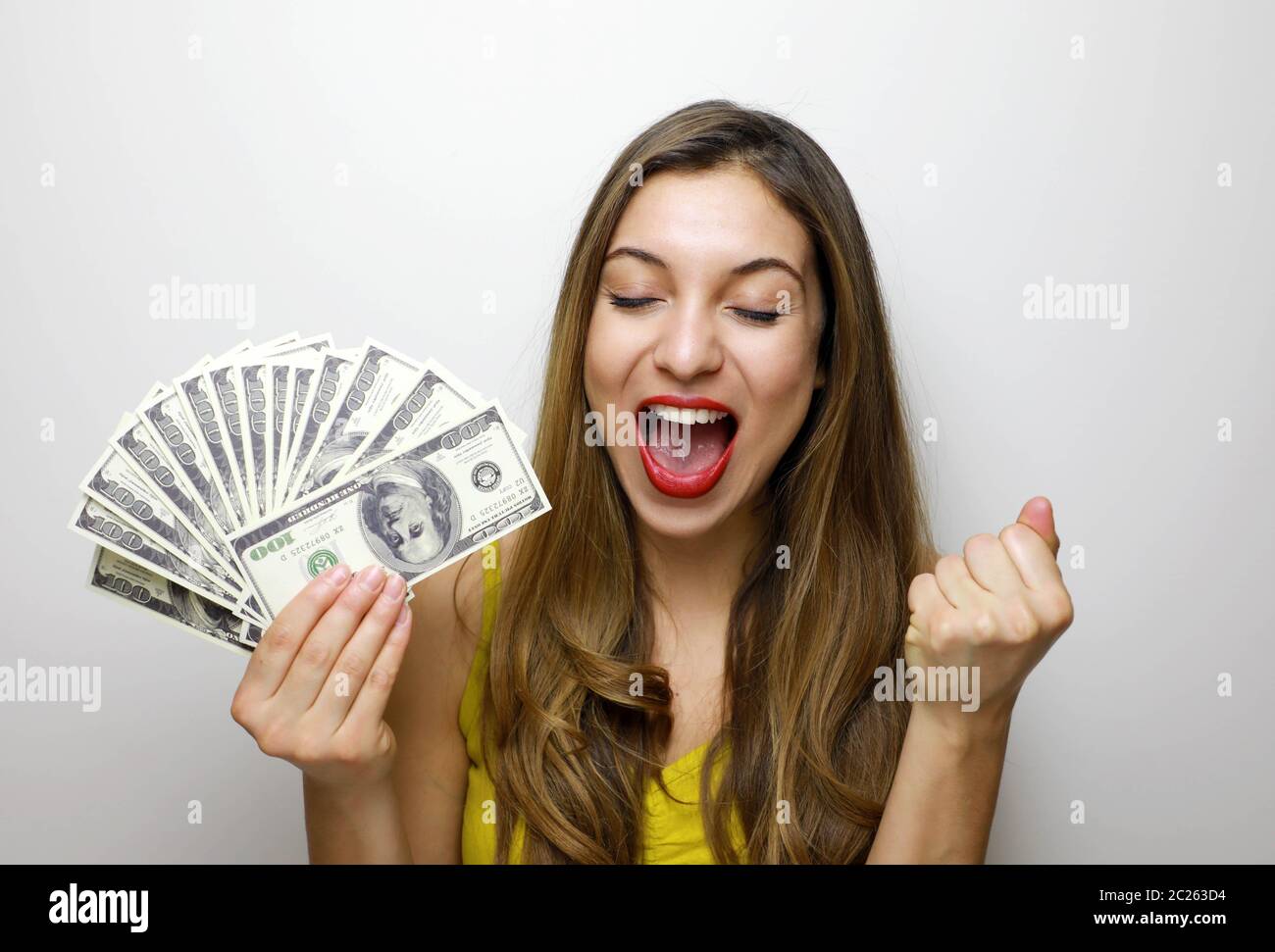 Woman holding cash notes isolated on white background. Young woman in ...