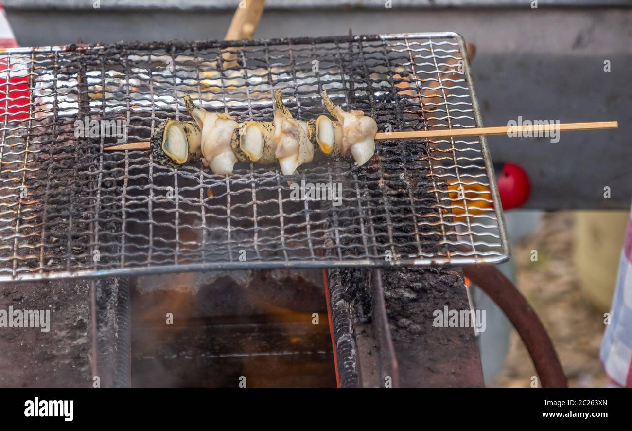 Skewed grilled seafood by a food vendor, Tokyo, Japan Stock Photo - Alamy