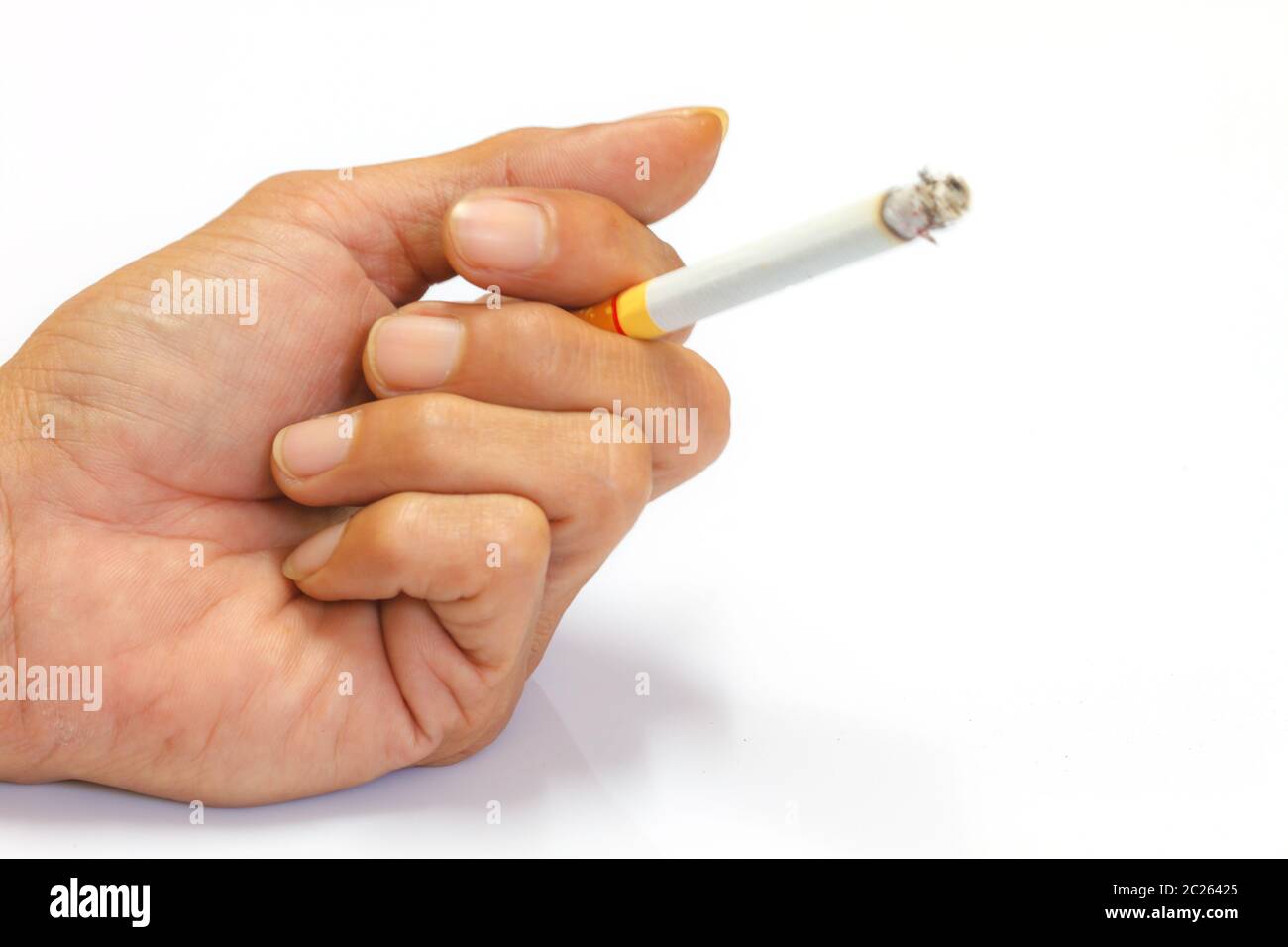 Cigarette in hand of men on white background Stock Photo - Alamy