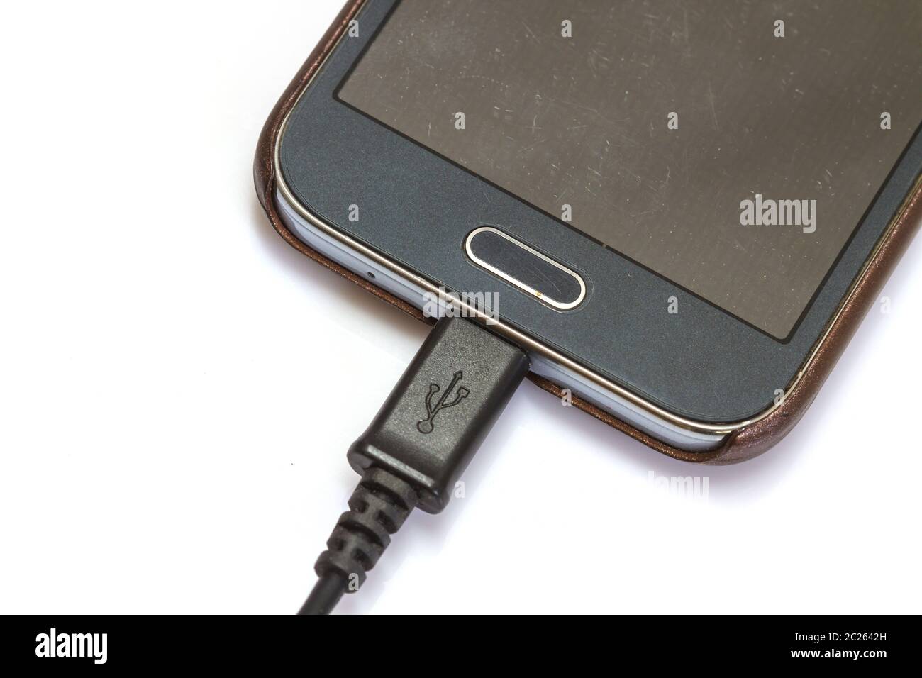close up smartphone charging on white background Stock Photo - Alamy