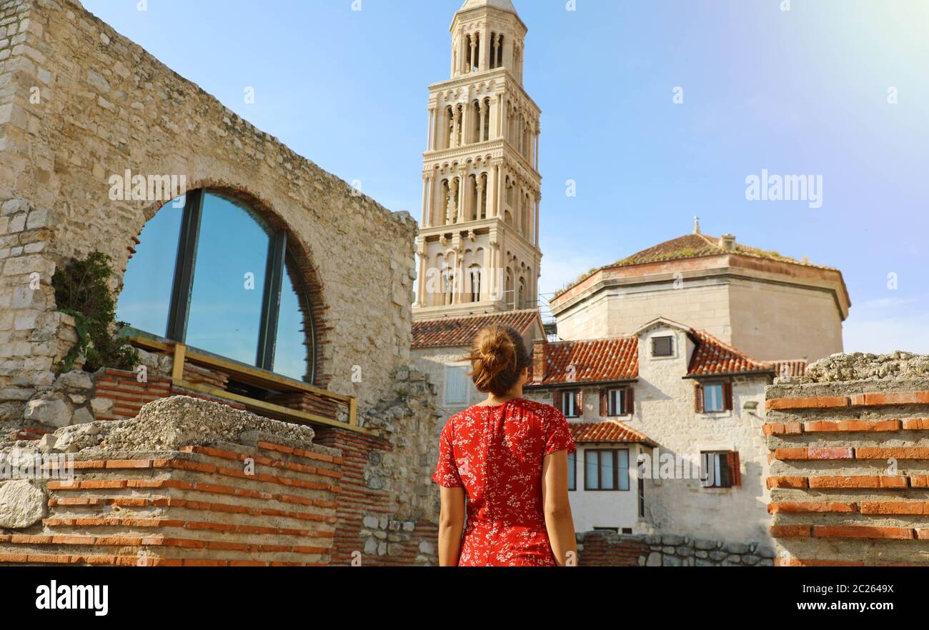Back view beautiful woman between old town ruins of Split, Croatia ...