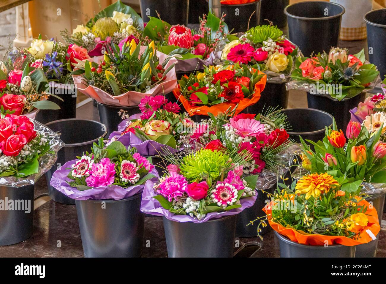 various bouquets of flowers in buckets Stock Photo - Alamy