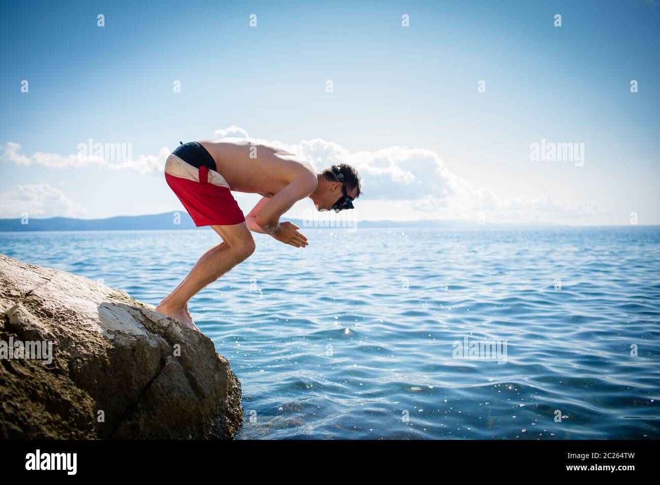 Adult male dive in to swimming pool hi-res stock photography and images ...