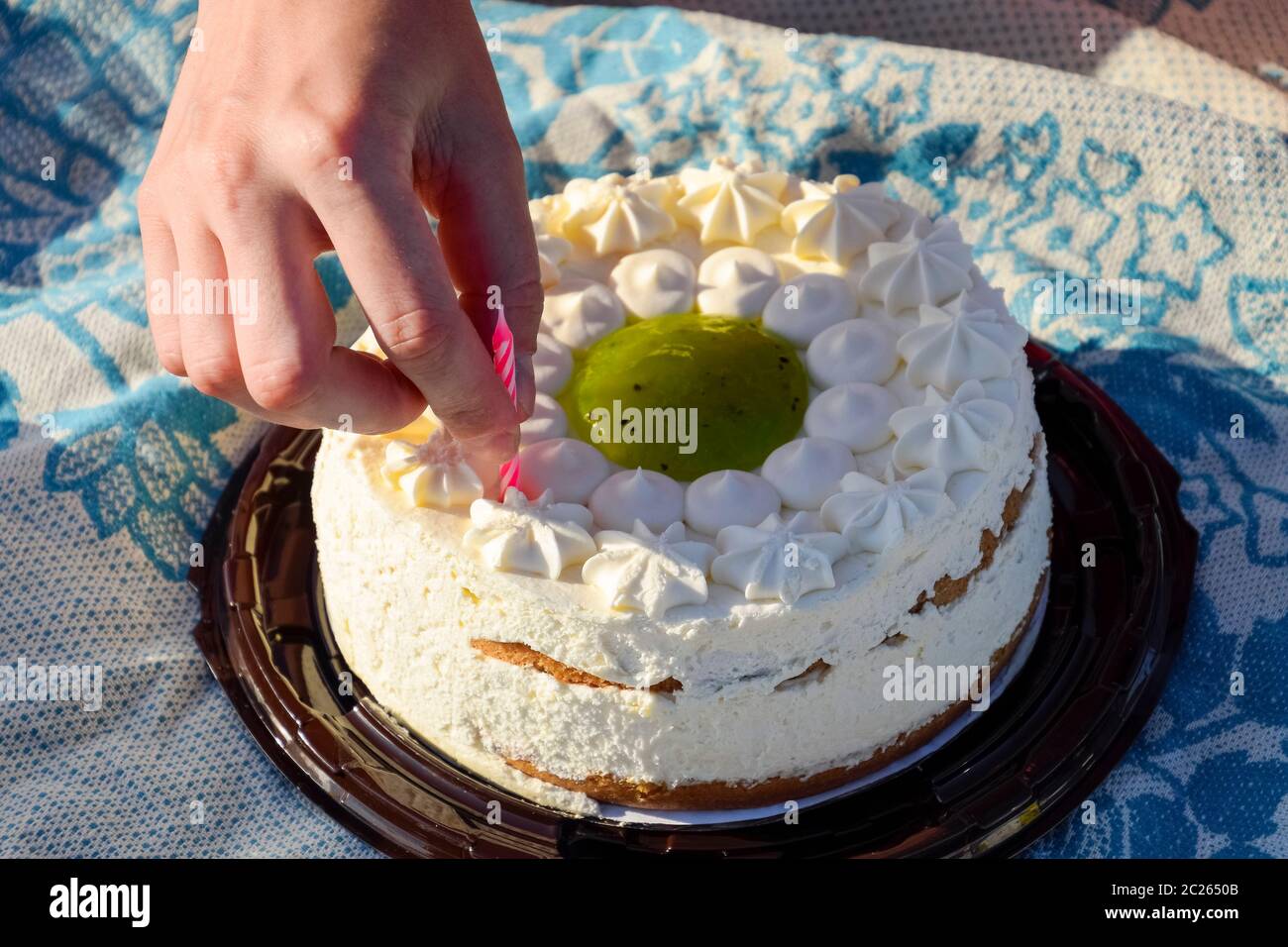 Woman putting candles in hi-res stock photography and images - Alamy