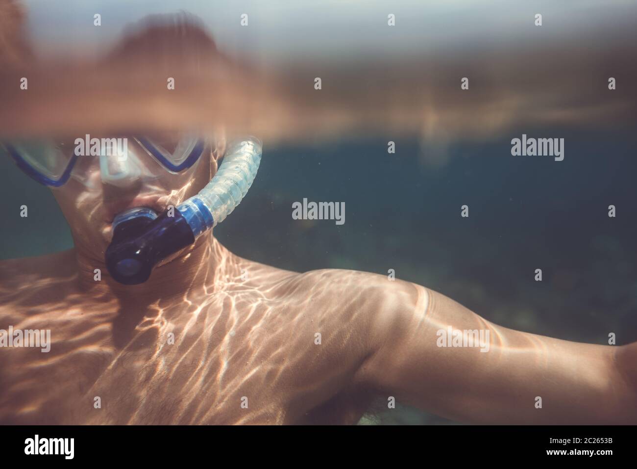 Swimming underwater in the sea goggles hi-res stock photography and ...