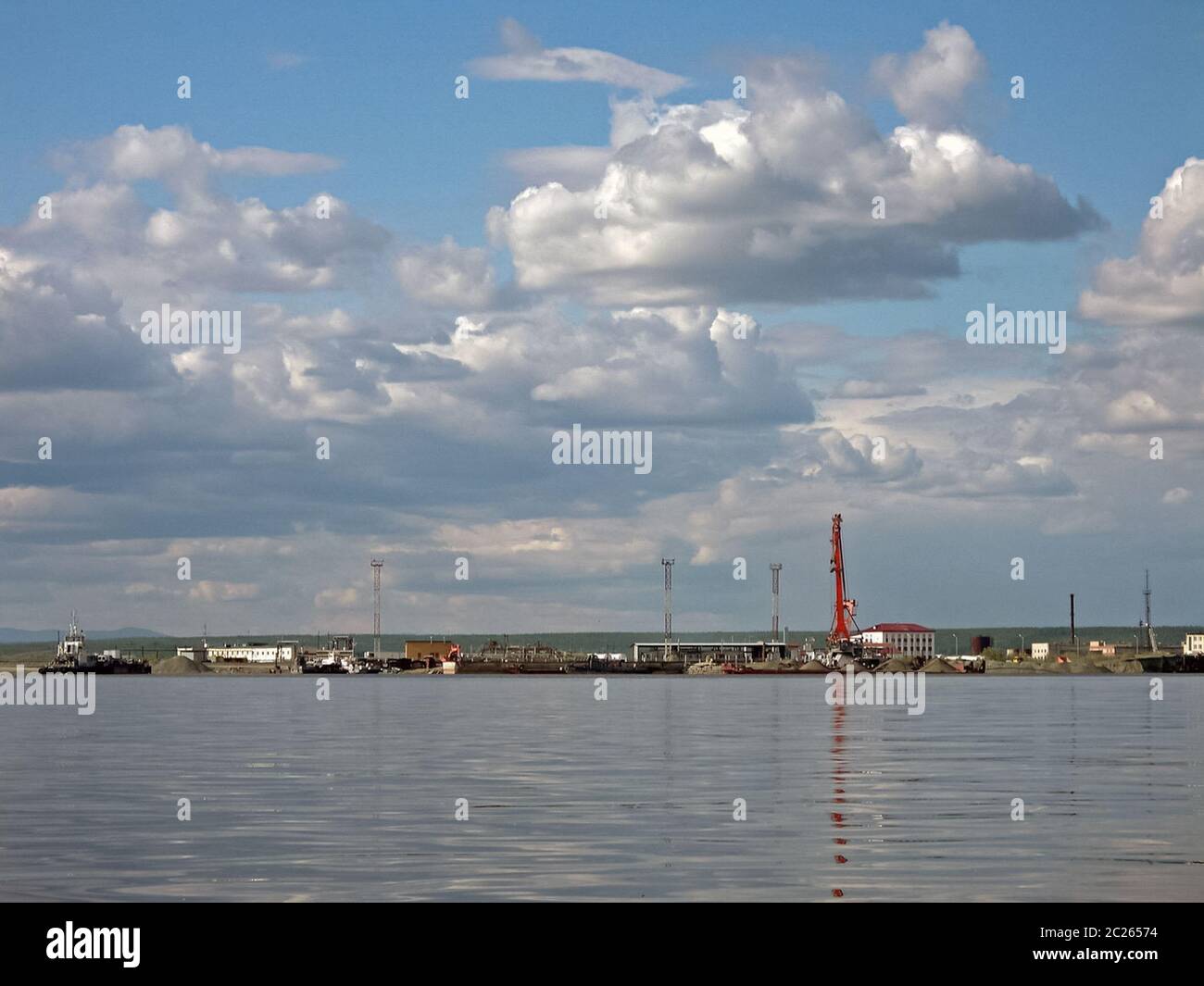 River port on the river of the city of Salekhard. Port cranes and ships ...