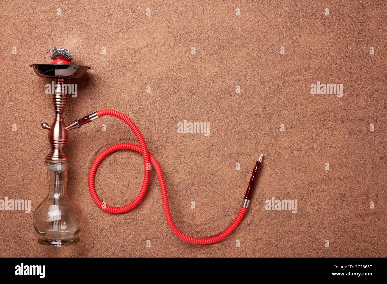 Turkish hookah (shisha) on a sand background Stock Photo - Alamy