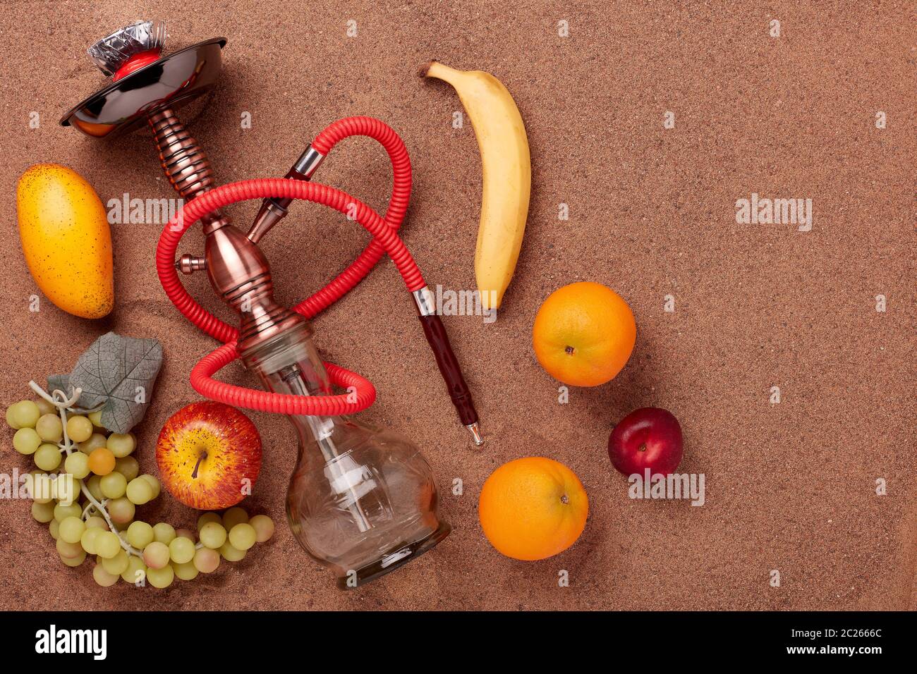 Turkish hookah (shisha) and fruit on a sand background Stock Photo - Alamy