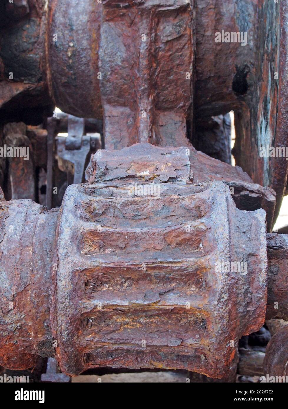 a close up of rusted cogs and gears on an old broken industrial machine ...
