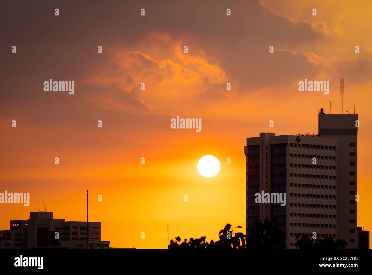 Hospital building at dusk with beautiful sunset sky. Silhouette of ...