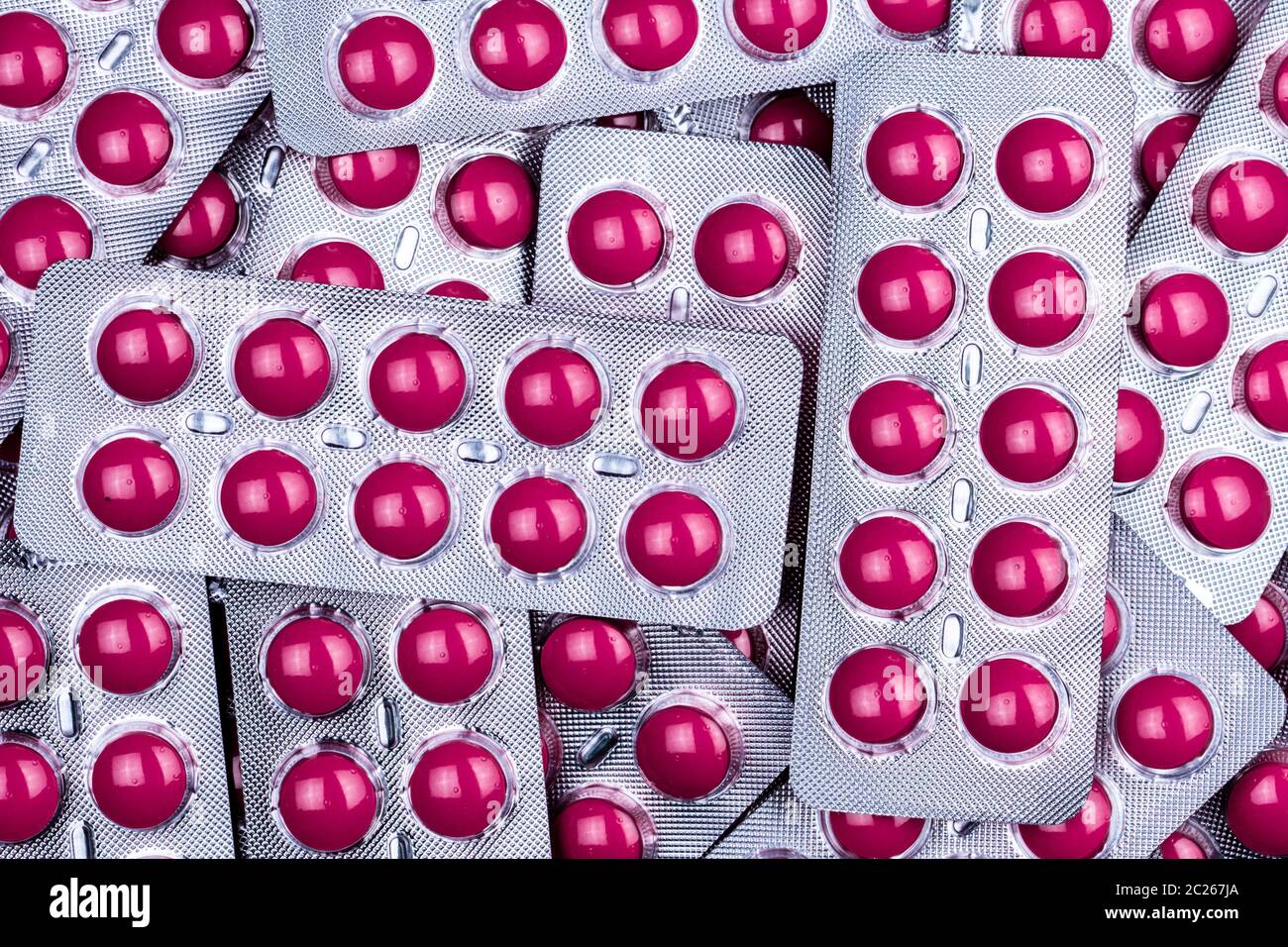 Pink tablets pill in blister pack. Painkiller medicine for treatment ...