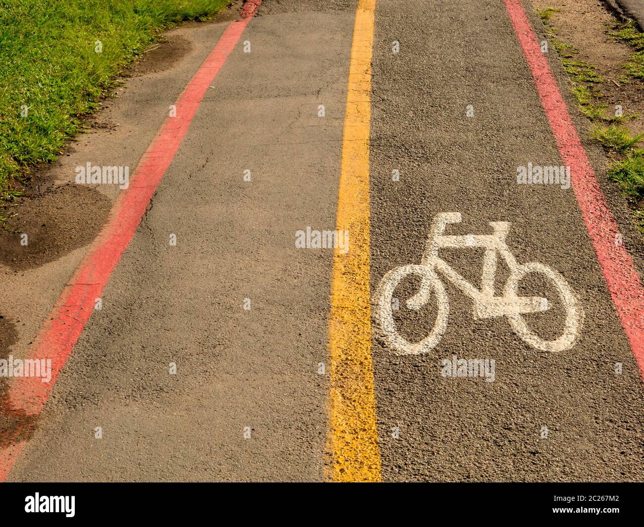 Bike Lane signs on streets ground Stock Photo - Alamy