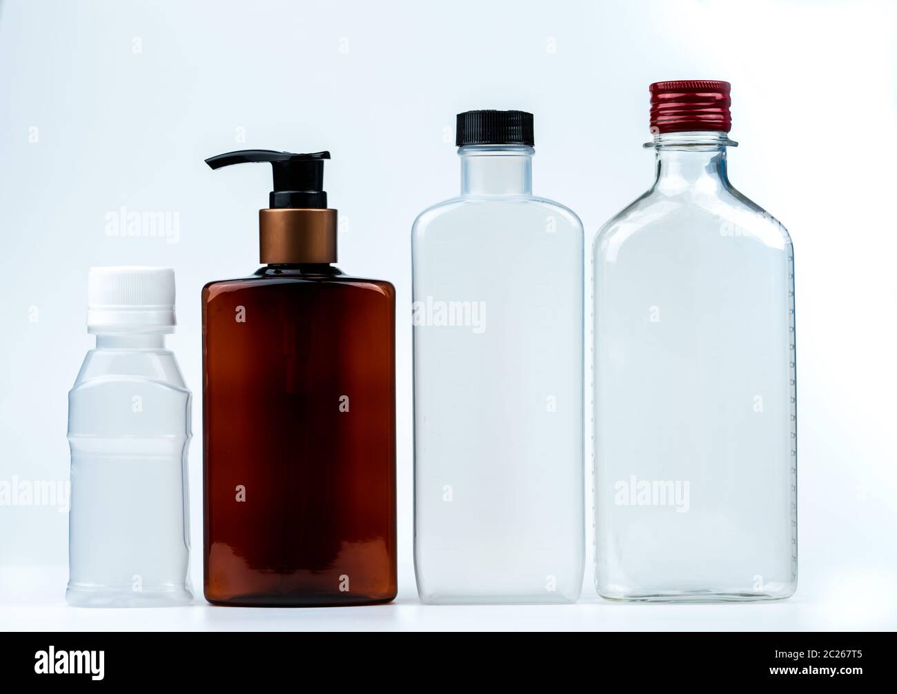 Empty plastic and glass bottle with cap and pump with black label ...