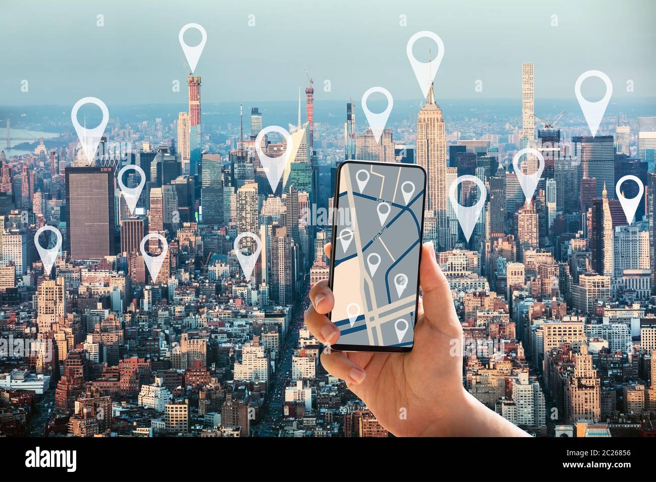 Tourist Using GPS Map Navigation Application On Mobilephone In New York ...