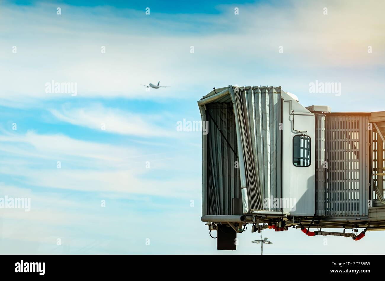 Jet bridge after commercial airline take off at the airport and the ...