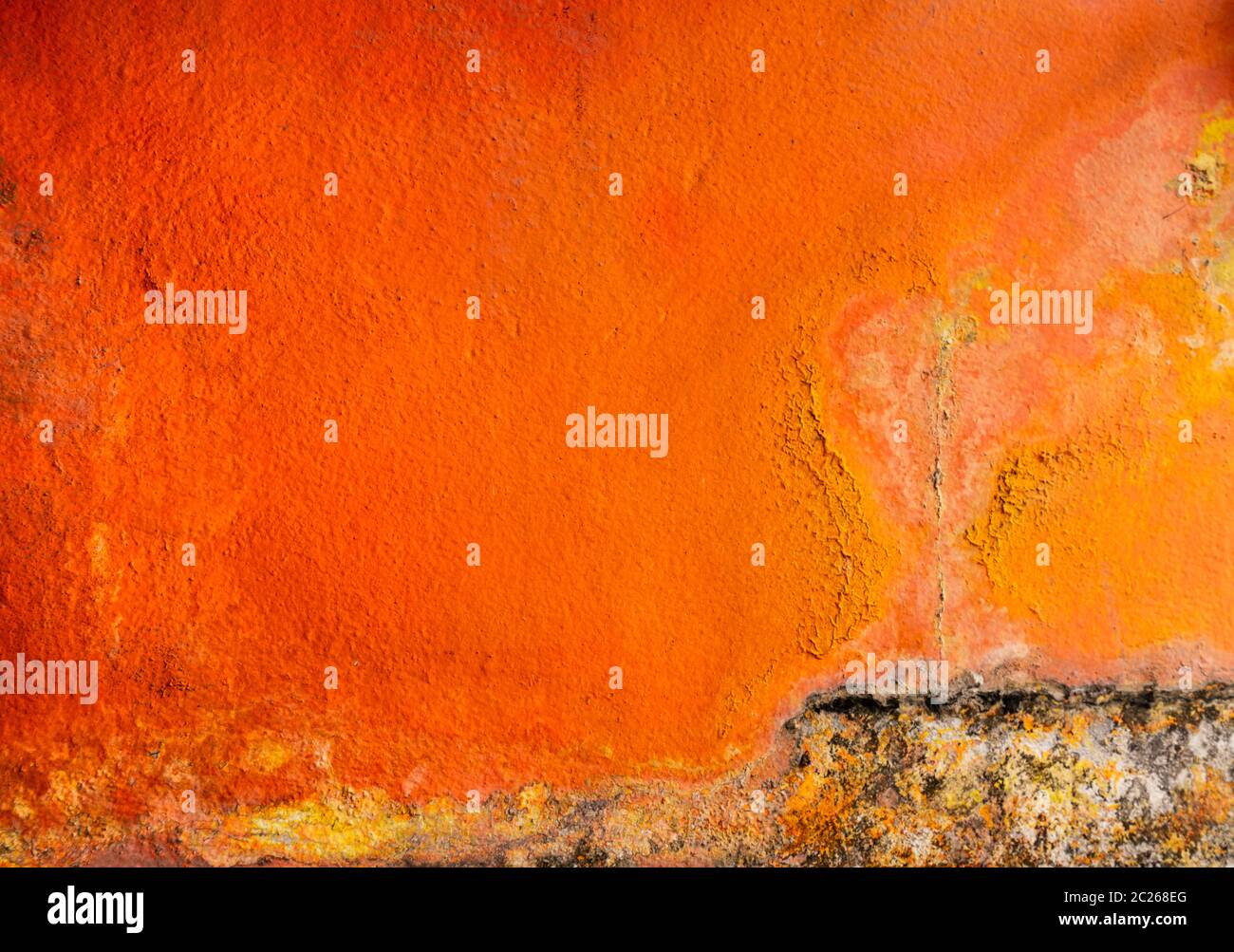 Old and dirty orange color painted on concrete wall texture background ...