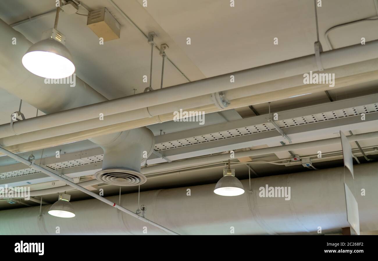 Air duct, wiring and plumbing in the mall. Air conditioner pipe, wiring ...
