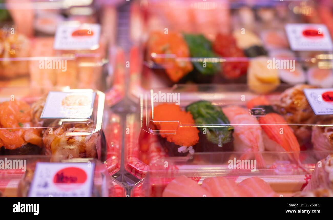 Selective focus on sushi set in plastic box display in shelf at ...