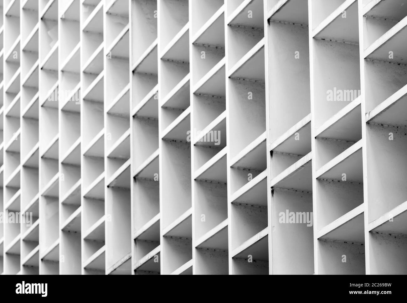 Closeup ventilated facade of concrete building. White ventilation with ...