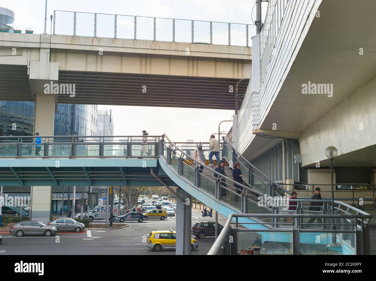 People crossing road bridge Shanghai Stock Photo - Alamy