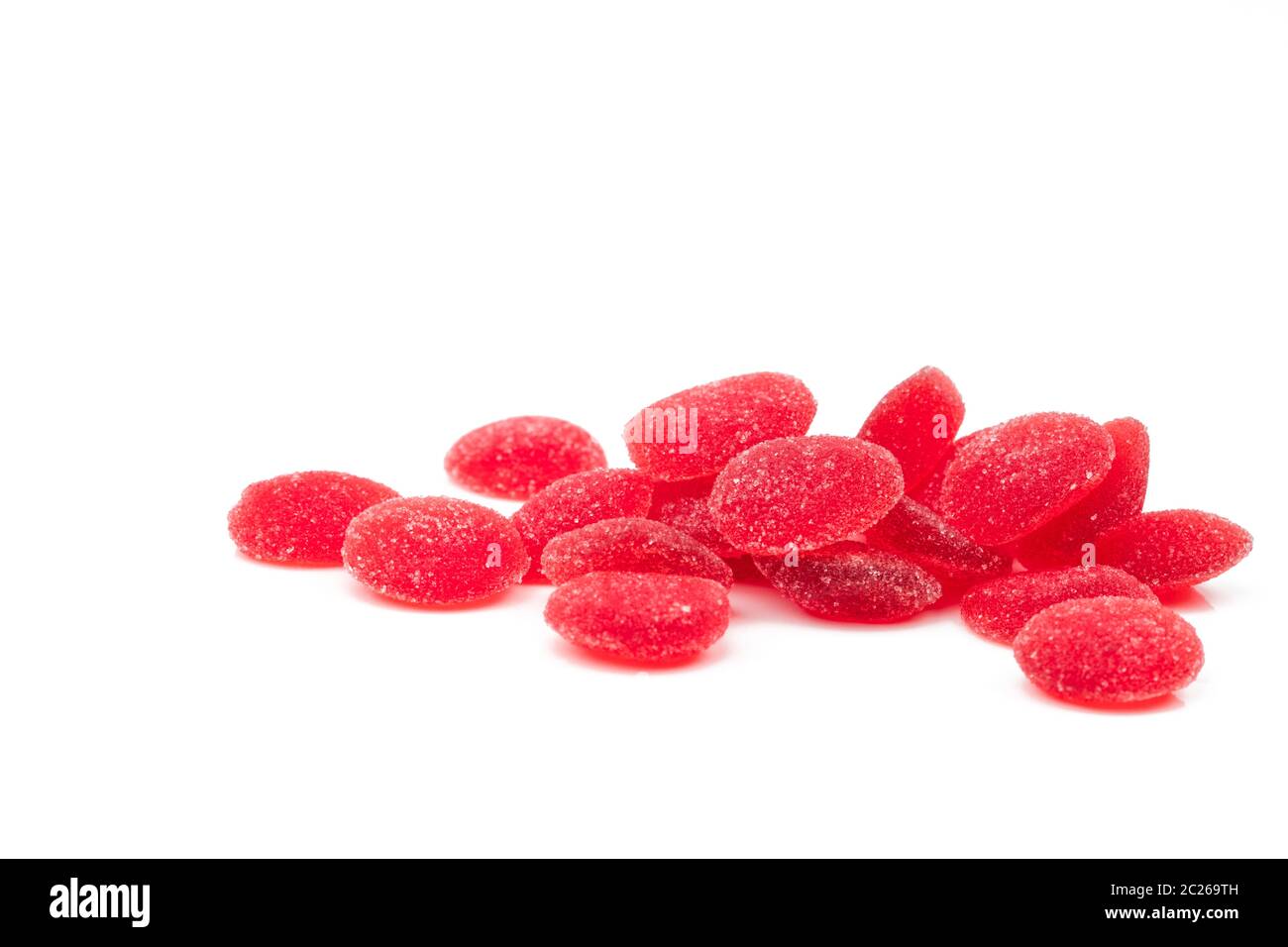 Pile of red vitamin pastille with clipping path. Multivitamin gummy for ...