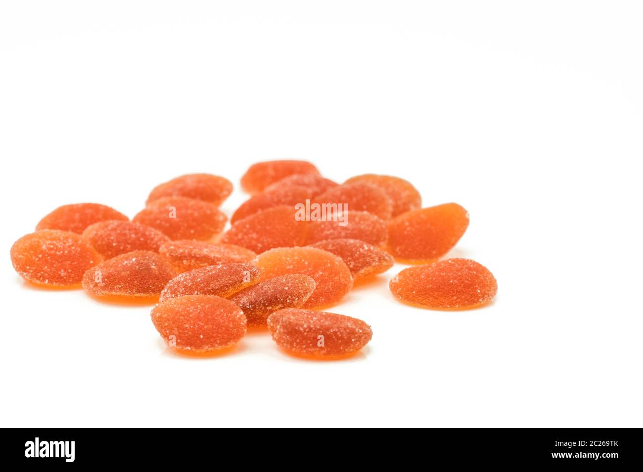 Pile of orange flavored vitamin pastille with clipping path ...