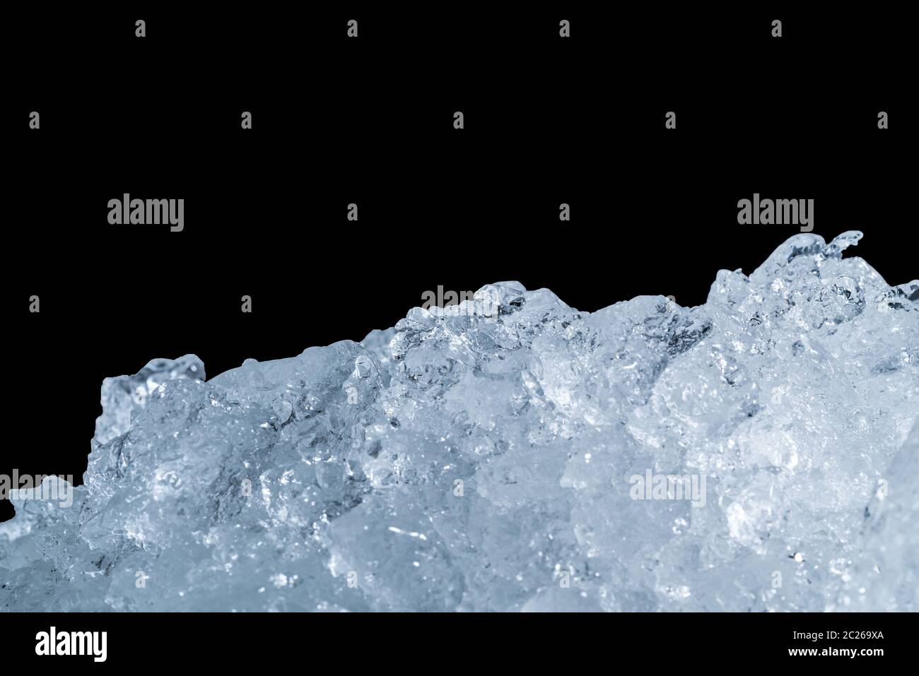 Pile of crushed ice cubes on dark background with copy space. Crushed ...