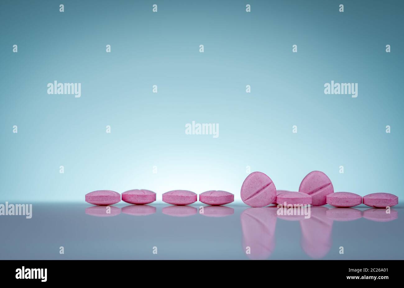 Pink tablets pills with shadow on gradient background. Pharmaceutical ...