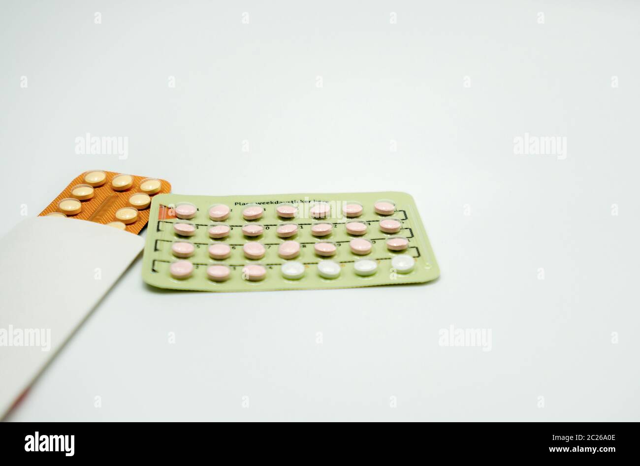 Contraceptive pills in blister pack on white background. Birth control ...
