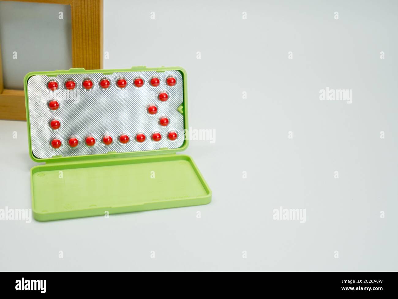 Contraceptive pills in blister pack on white table. Birth control pills ...